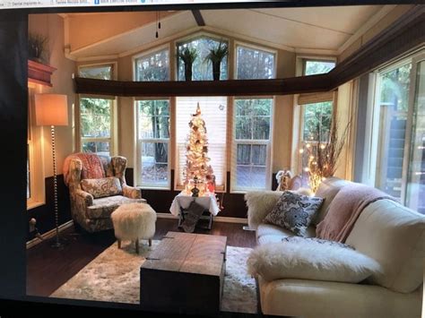 A Living Room Filled With Furniture And A Christmas Tree