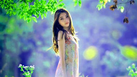 Beautiful Girl Model Is Standing In Blur Blue Background Wearing
