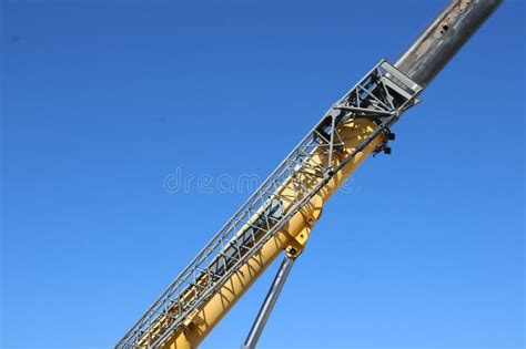 A Telescoping Section Of Far Reaching Crane Is Seen On A Blue Sky Stock Image Image Of Mast
