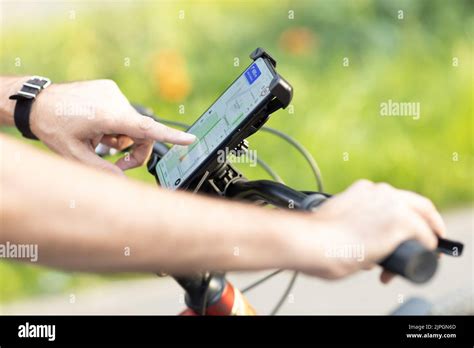 man planning route using gps navigation application in mobile phone on