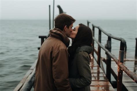 Premium Photo Crop Couple Kissing On Pier