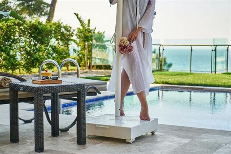 Premium Photo Person Standing Near Swimming Pool Photo