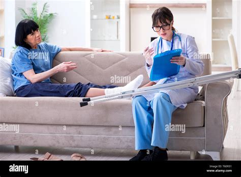 Doctor Examining Old Mature Woman After Incident Stock Photo Alamy