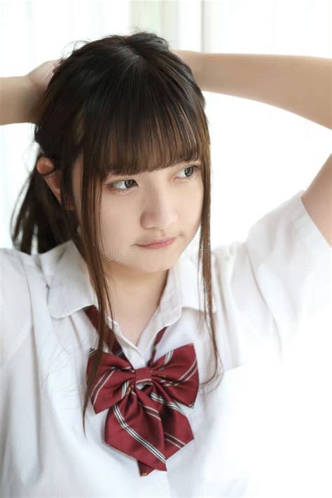 Portrait Japanese School Girl Uniform In White Tone Bed Room Stock