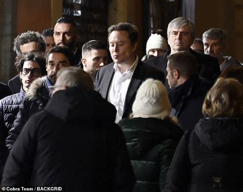 Elon Musk Is Flanked By Massive Security Detail As He Takes Young Son