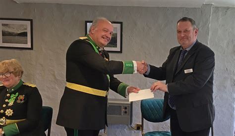The Deputy Bailiff Presented A Cheque To The Regional Manager Of The