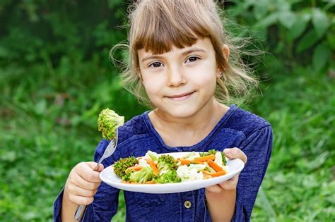 Premium Photo Portrait Of Cute Girl Eating Food