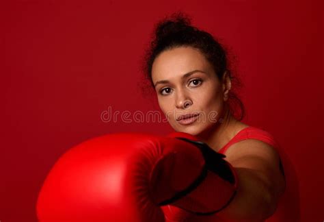 Close Up Portrait Of Concentrated Young Sports Woman Boxer Wearing Red