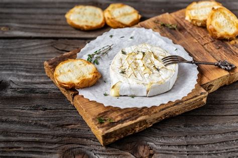 Premium Photo Traditional French Homemade Baked Camembert Cheese With Thyme And Baguette Bread