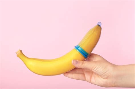 Premium Photo Woman Putting Condom On Banana Isolated On White Premium Photo Woman Putting Condom On Banana Isolated On White