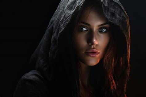 Premium Photo Portrait Of A Beautiful Woman In A Hood Over Black