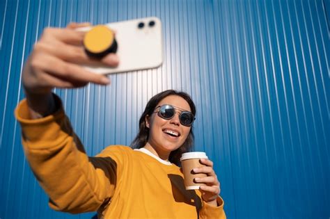 Free Photo Adult Using Pop Socket On Phone