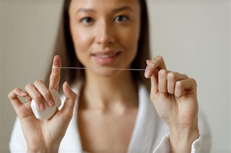 Premium Photo Portrait Of Attractive Smiling Young Woman Engaged In