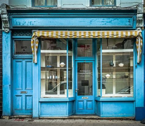 Quaint Blue Storefront With Awning