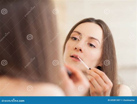 Beautiful Young Woman Applying Lipgloss Stock Image Image Of Long
