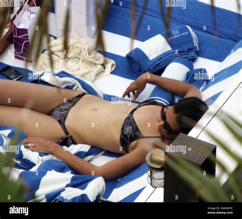 Katie Holmes Shows Off Her Slender Figure In A Black Bikini As She