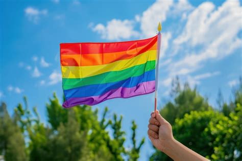 Premium Photo Hand Holding Colorful Rainbow Gay Flag Symbol Of Lgbtq