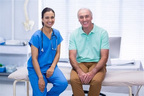Premium Photo Portrait Of Smiling Doctor And Senior Patient