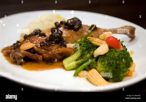 Honey Glazed Roasted Duck Leg With Dried Fruit Stock Photo Alamy