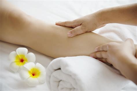 Woman Receiving Foot Massage Service From Masseuse Close Up At Hand And Foot Relax In Foot
