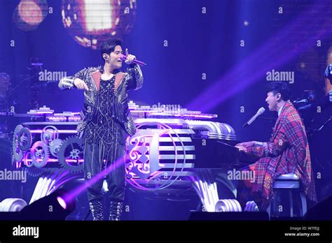 Taiwan Outtaiwanese Singer Jay Chou Left And Singaporean Singer