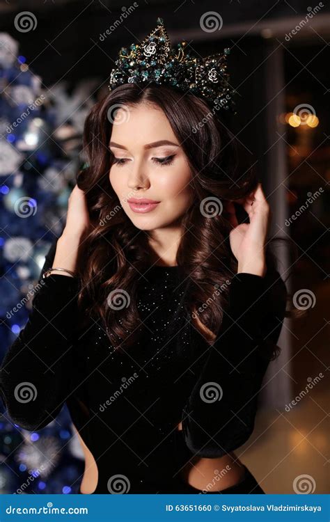 Sensual Woman Wears Elegant Dress Posing Beside Decorated Christmas