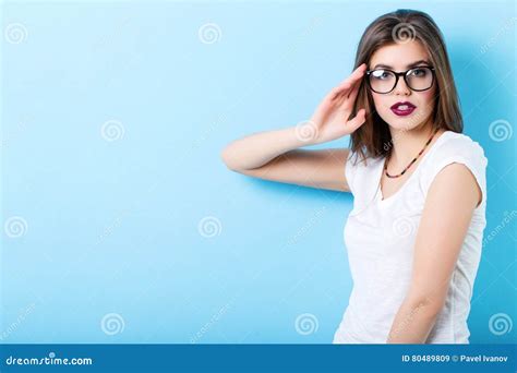 Portrait Of A Young Beautiful Confident Woman In Stylish Glasses Stock