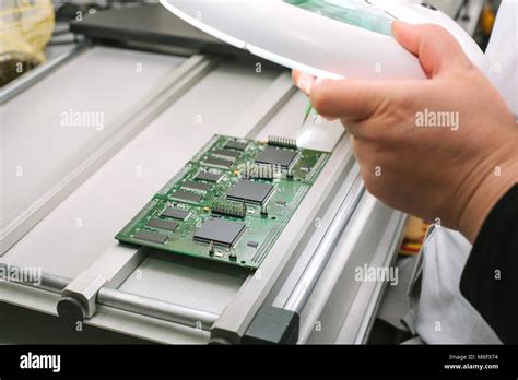 Female Computer Expert Professional Technician Examining Board Computer