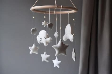 Premium AI Image | A baby mobile with stars and moon on the top.