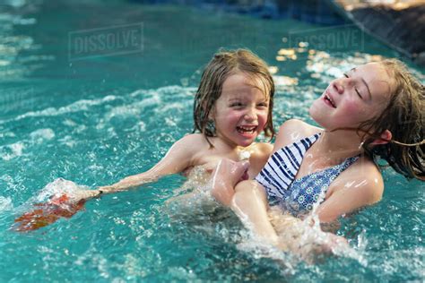 Caucasian Brother And Sister Playing In Swimming Pool Royalty Free