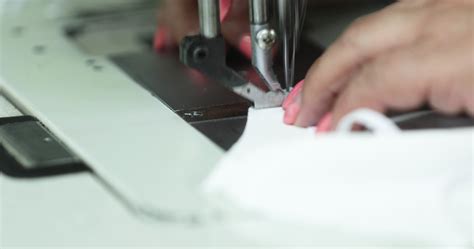 Hand Of A Woman Attaching The Elastic String Stitching Along The Edges
