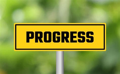 Premium Photo Progress Road Sign On Blur Background