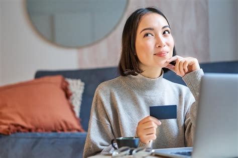 Free Photo Happy Smiling Girl With Credit Card Paying Her Bills