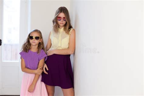 Two Girls Posing On A Grey Background Stock Image Image Of Background