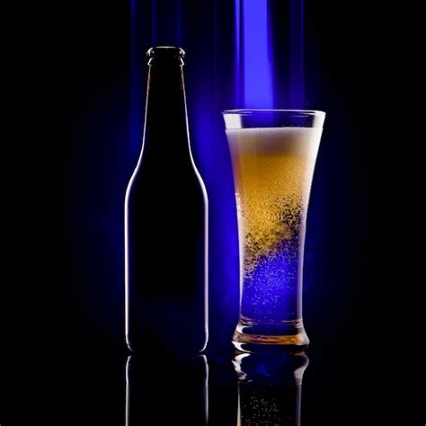 Premium Photo Pilsner Glass And Bottle In Black Background On