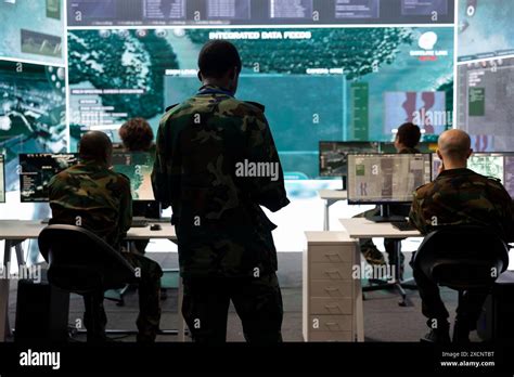 Infantry Unit Trooper Analyzing Intelligence Gathered From Satellite System Military Command