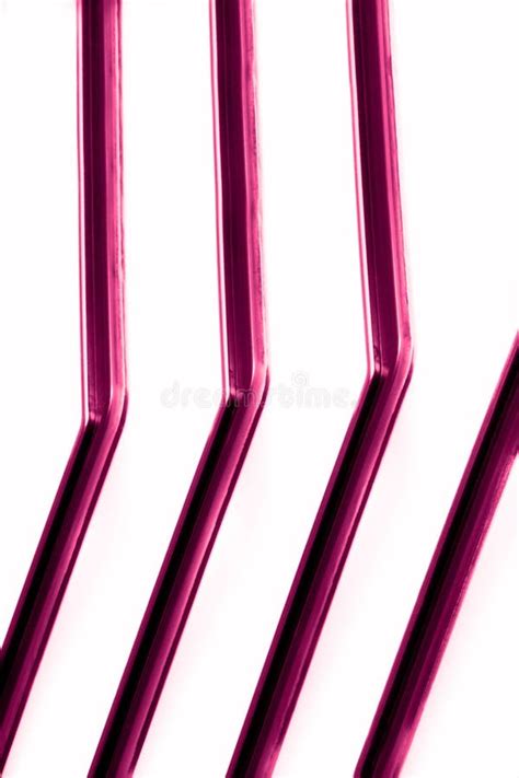 Shiny Mauve Coloured Bent Bars On A White Background Stock Image