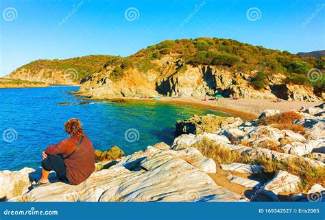 Woman At Chia Beach Looking At Lagoon Mediterranian Sea Reflex