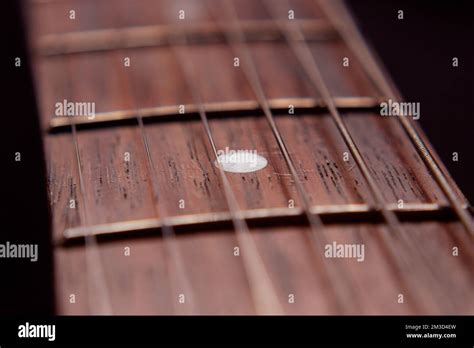 Macro Photography To A Six Electric Guitar Strings And Wooden