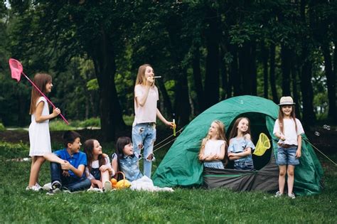 Free Photo Group Of Girls Camping In Forest