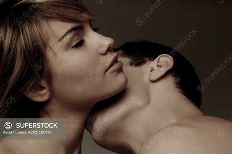 Man Kissing Woman S Neck Superstock