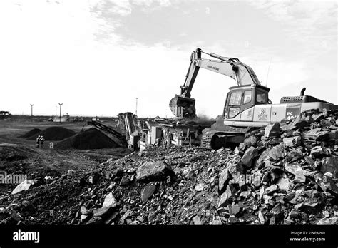Monochrome Image Of A Man On A Garbage Heap Stock Photo Alamy