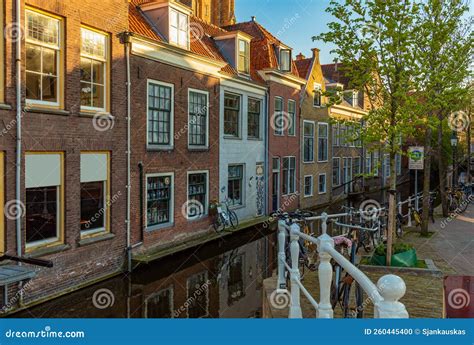 Typical Dutch Houses Along The Water Canal In Delft South Holland