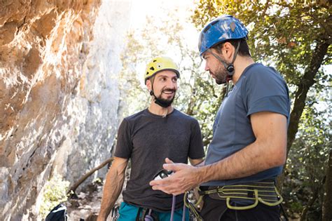 Climber Teaching The Use Of Climbing Fall Protection And Climbing Rope