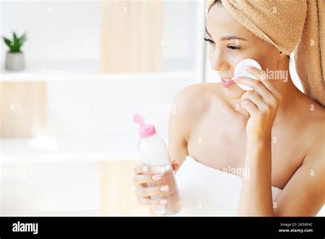 Woman Using Applying Cream Softening Moisturizer With Cotton Pad On Her