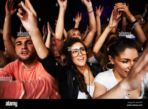 These Girls Love Their Music Attractive Female Fans Enjoying A Concert