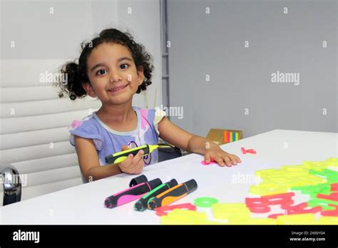 3 Year Old Latina Brunette Girl With Curly Hair Draws As Therapy For