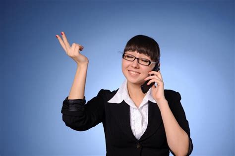 Premium Photo A Pretty Business Woman Sitting At Table And Calling