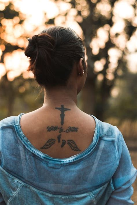 Unrecognizable Young Tattooed Woman Admiring Nature In Park · Free