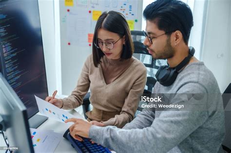 Asian And Indian Developer Team Discussion Feedback Analysis Coding Data With Software Computer